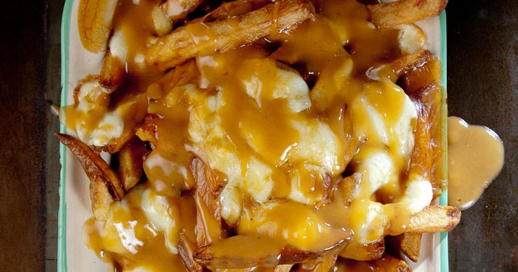 Poutine (French Fries with Gravy and Cheese Curds) | Saveur